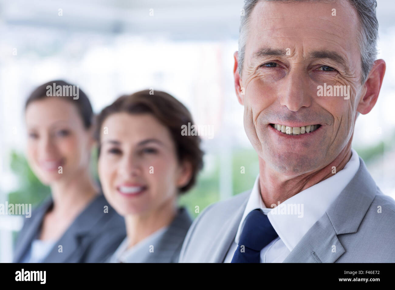 Business people looking at camera Stock Photo - Alamy