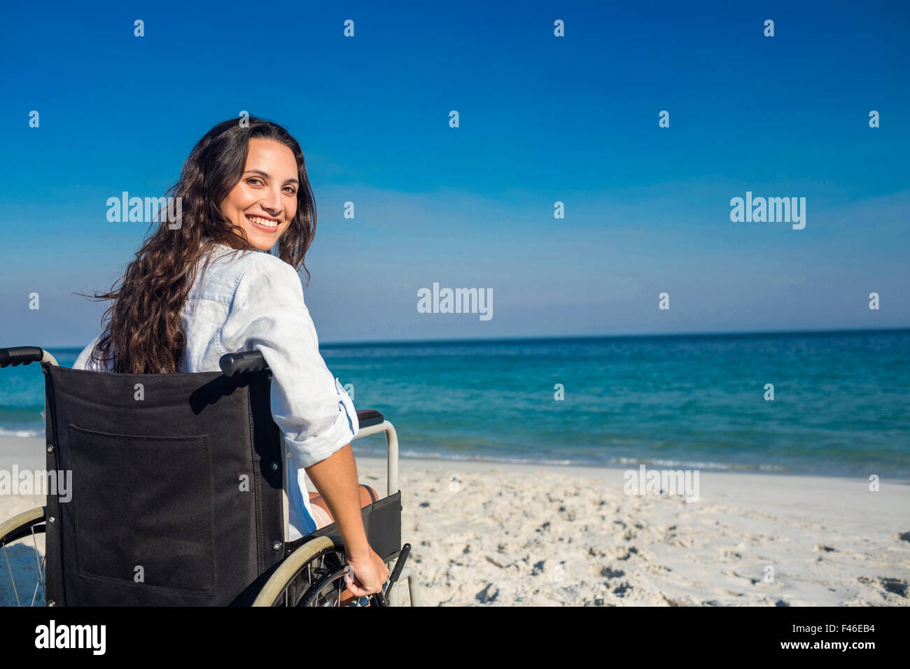 Disabled woman looking at camera Stock Photo - Alamy