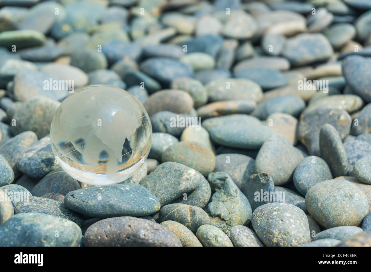 Earth transparent glass with stone Stock Photo - Alamy