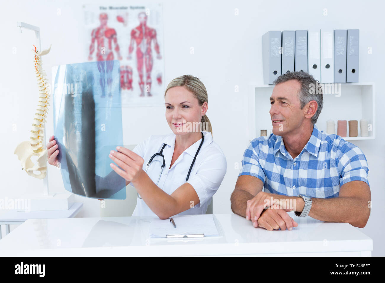 Doctor showing X rays to her patient Stock Photo - Alamy