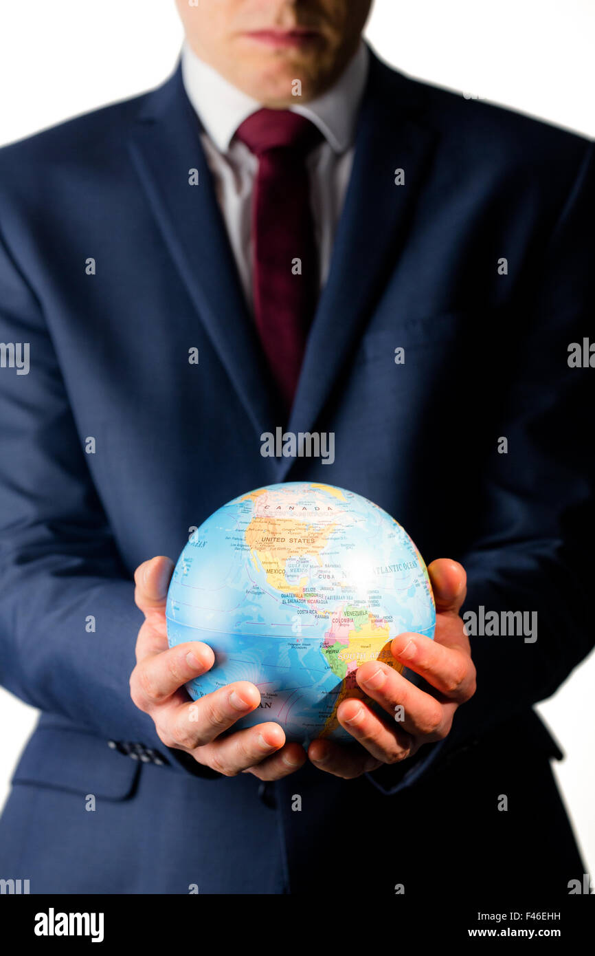 Hand of businessman holding terrestrial globe Stock Photo - Alamy