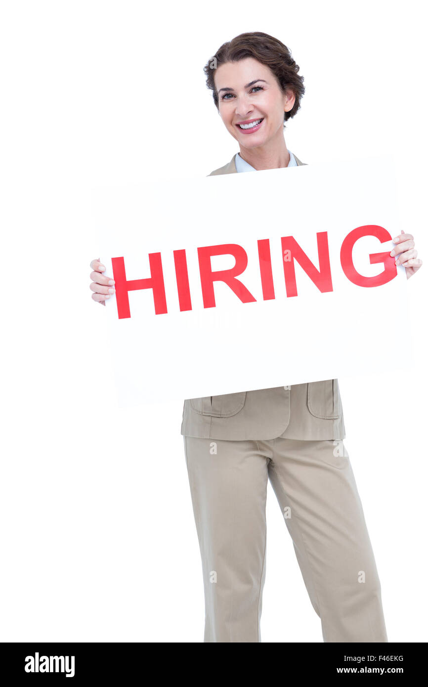 Businesswoman holding a hiring sign Stock Photo - Alamy
