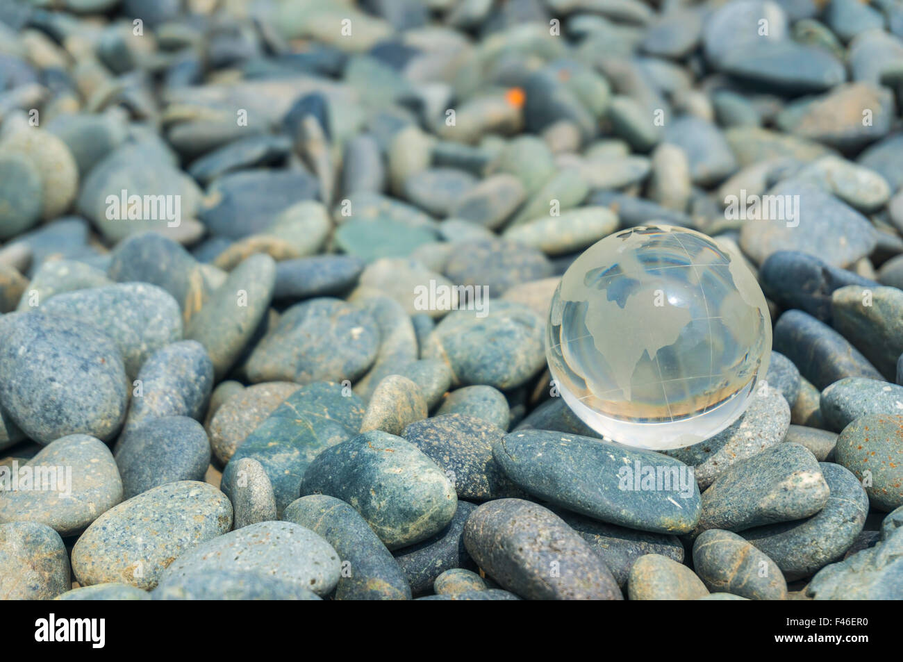 Earth transparent glass with stone Stock Photo - Alamy