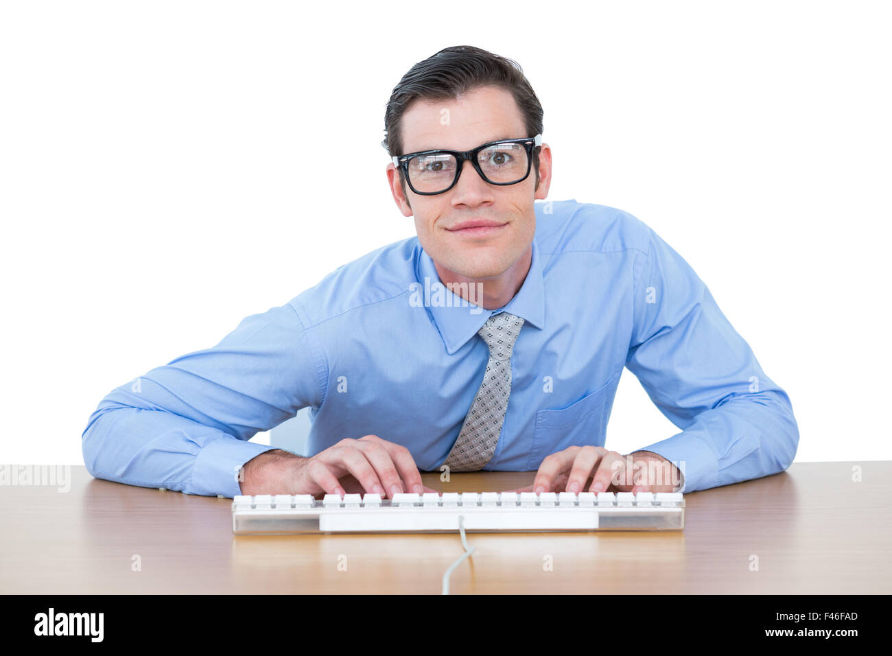 Businessman typing at his desk Stock Photo - Alamy