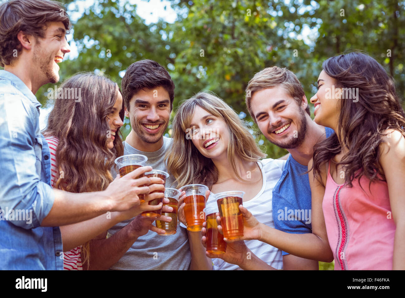 Happy friends in the park Stock Photo - Alamy