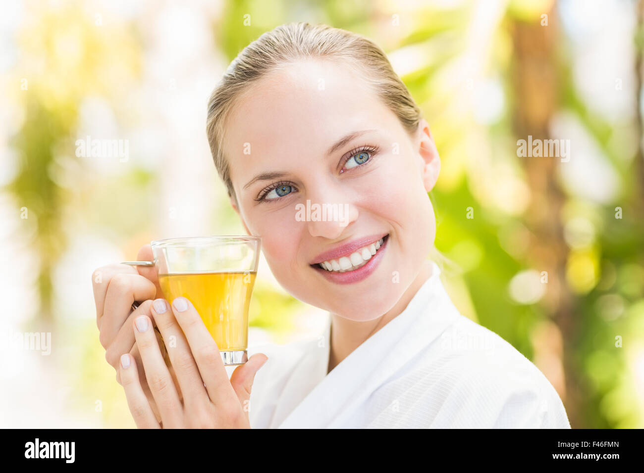 Attractive woman drinking tea Stock Photo - Alamy