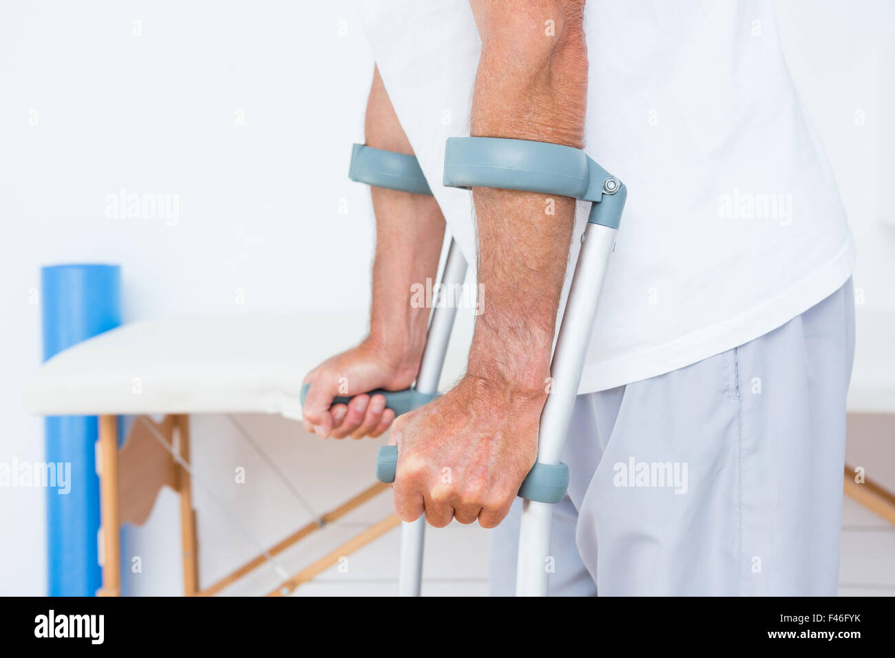 Patient standing with crutch Stock Photo - Alamy