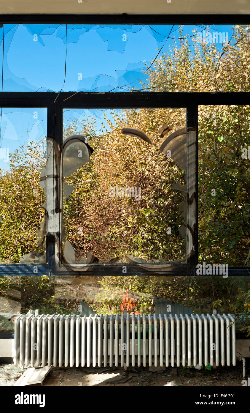 window view and old radiator, abandoned building Stock Photo - Alamy