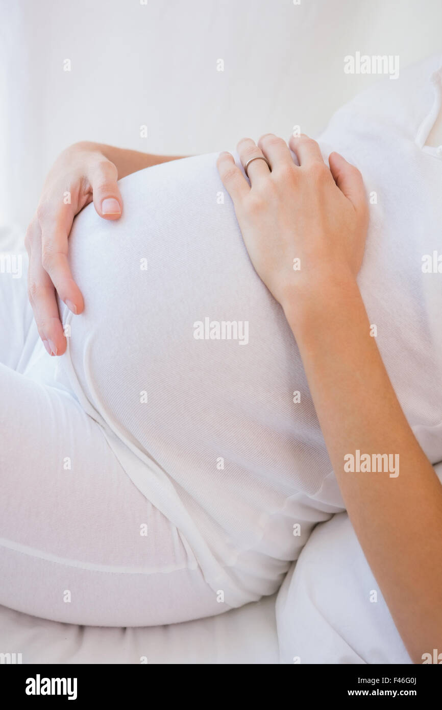 Belly pregnancy sitting in sofa hi-res stock photography and images - Alamy