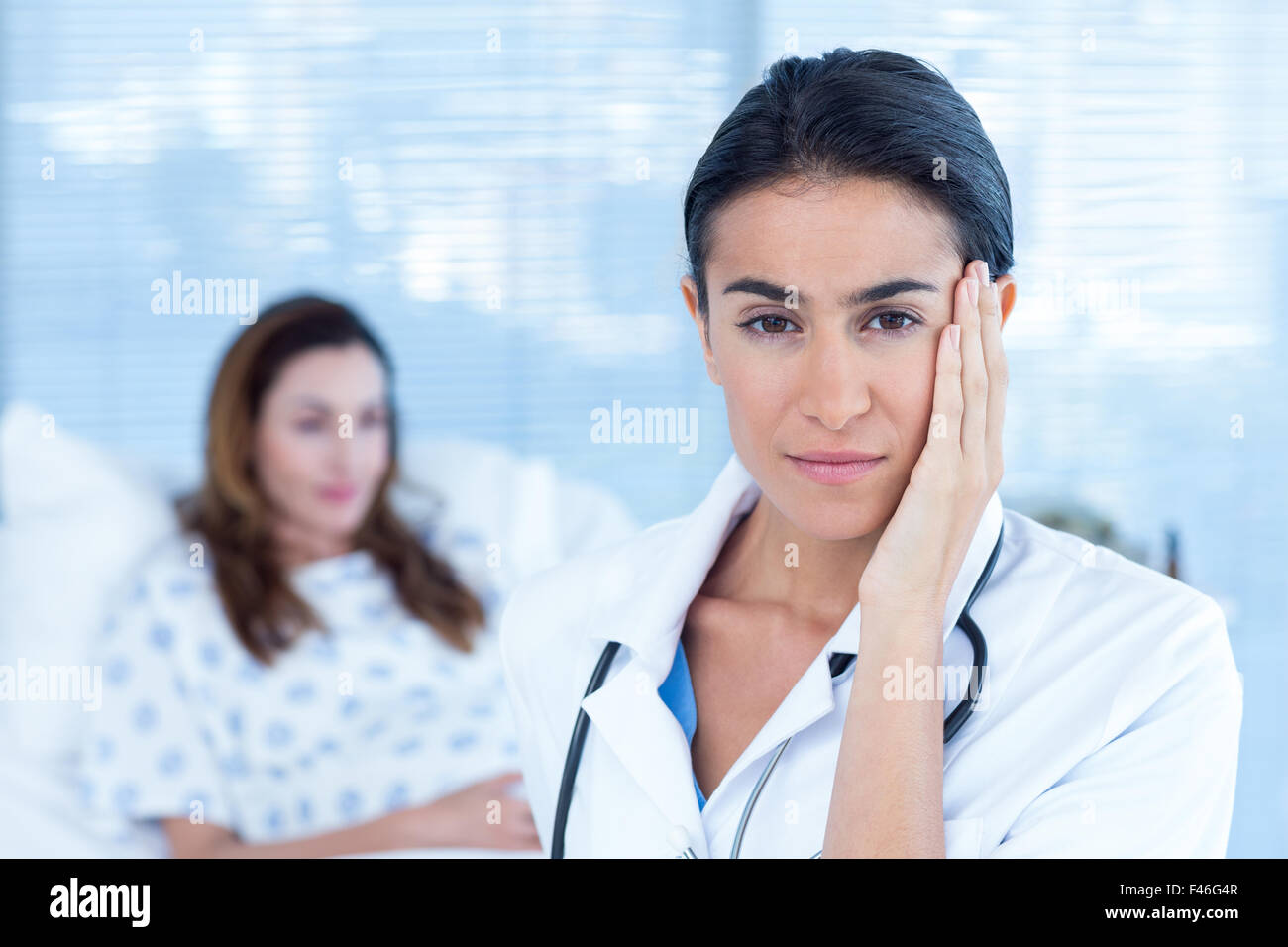 Serious doctor looking at camera Stock Photo - Alamy