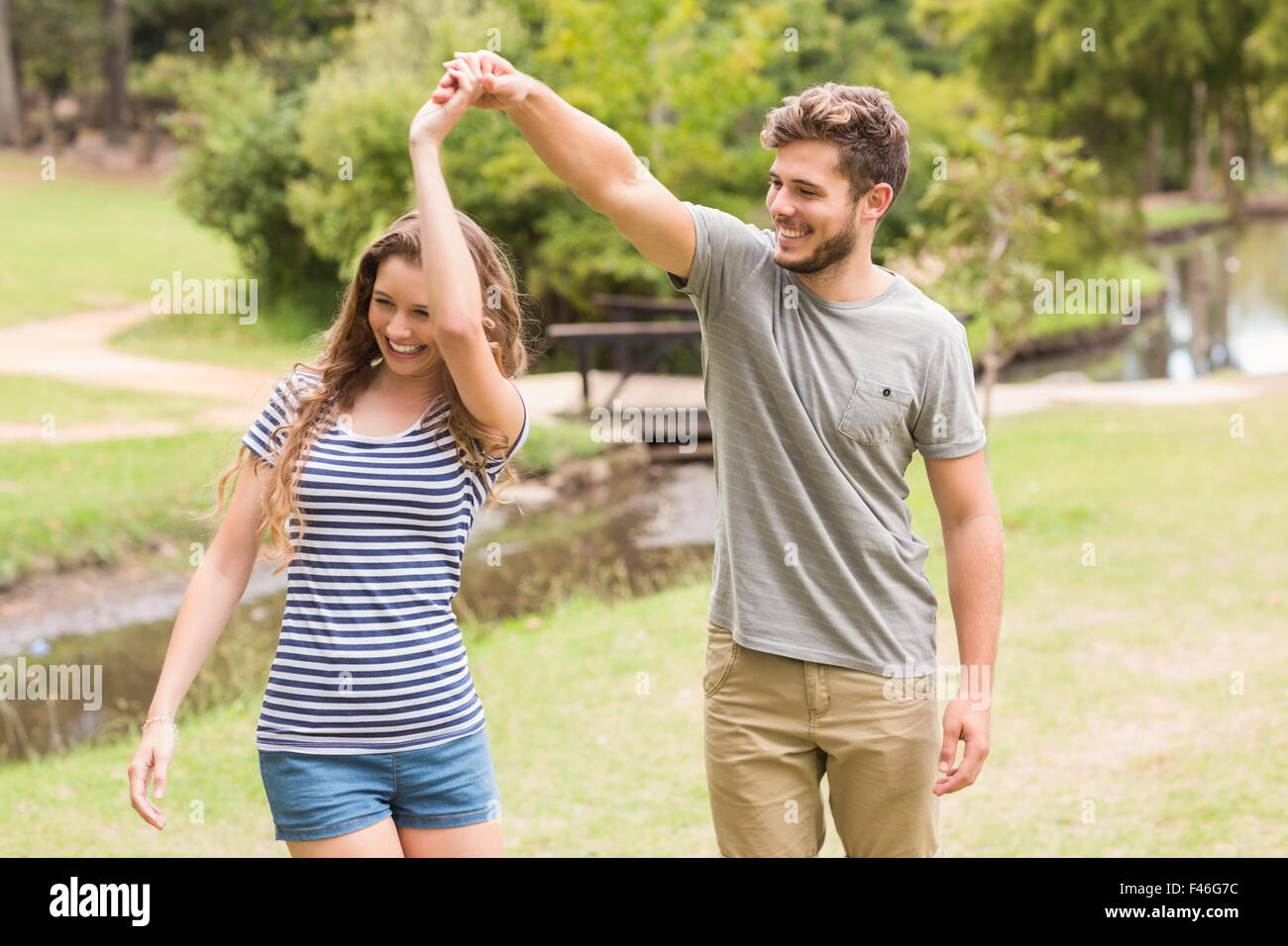 Cute couple dancing in the park Stock Photo - Alamy
