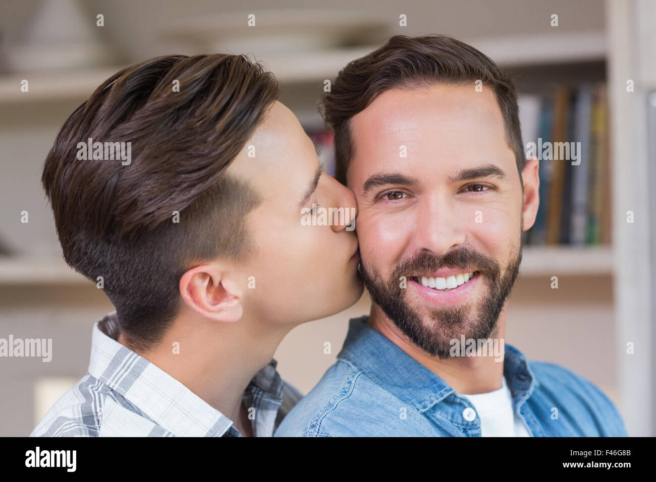 Handsome man embracing his boyfriend Stock Photo - Alamy