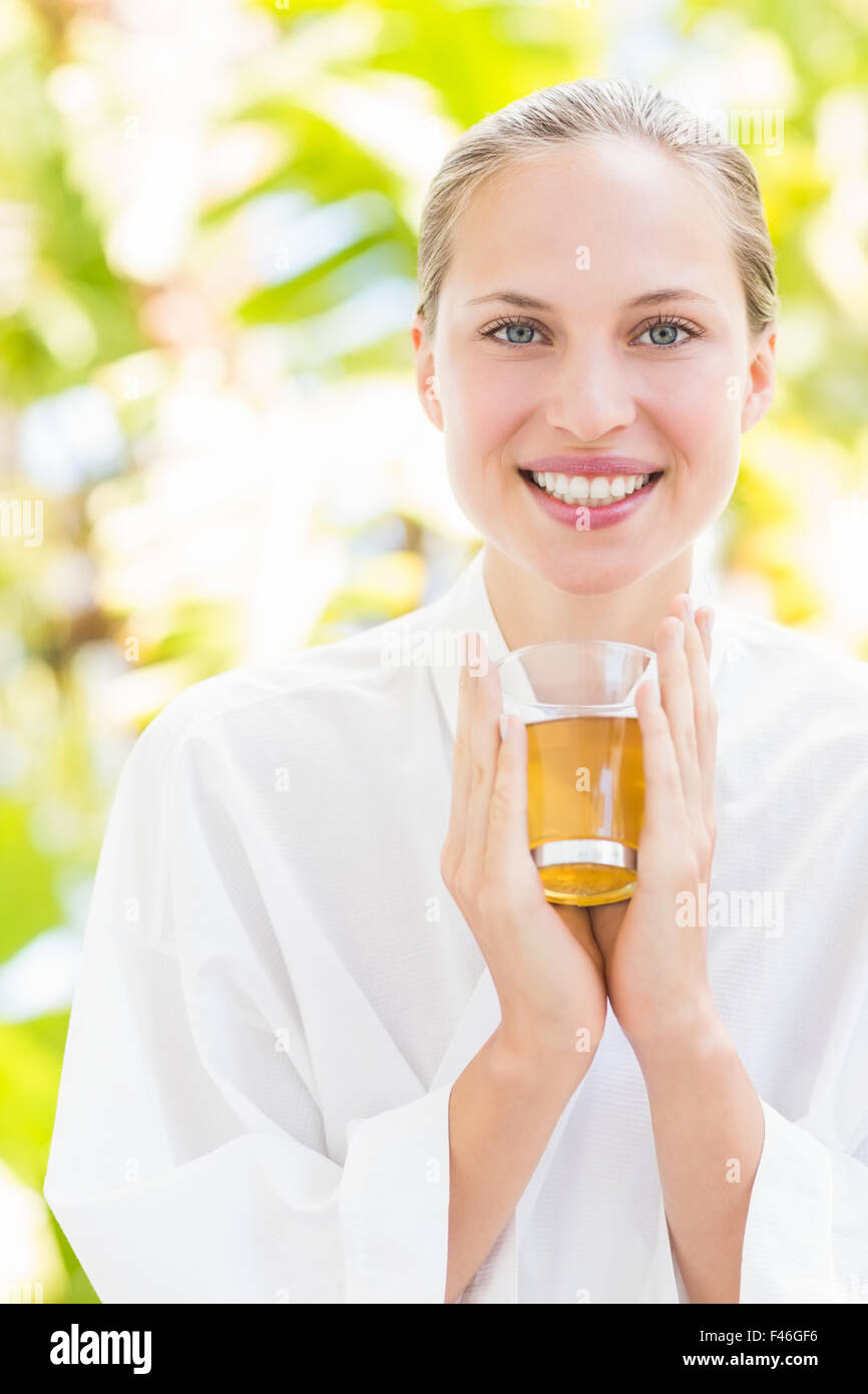 Attractive woman drinking tea Stock Photo - Alamy