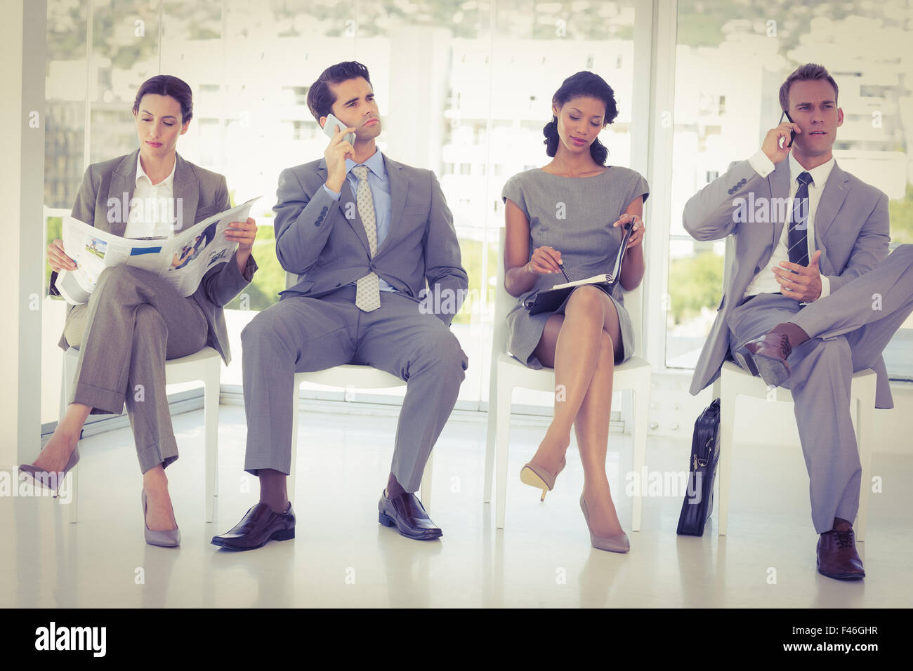 Business people sitting and waiting Stock Photo - Alamy