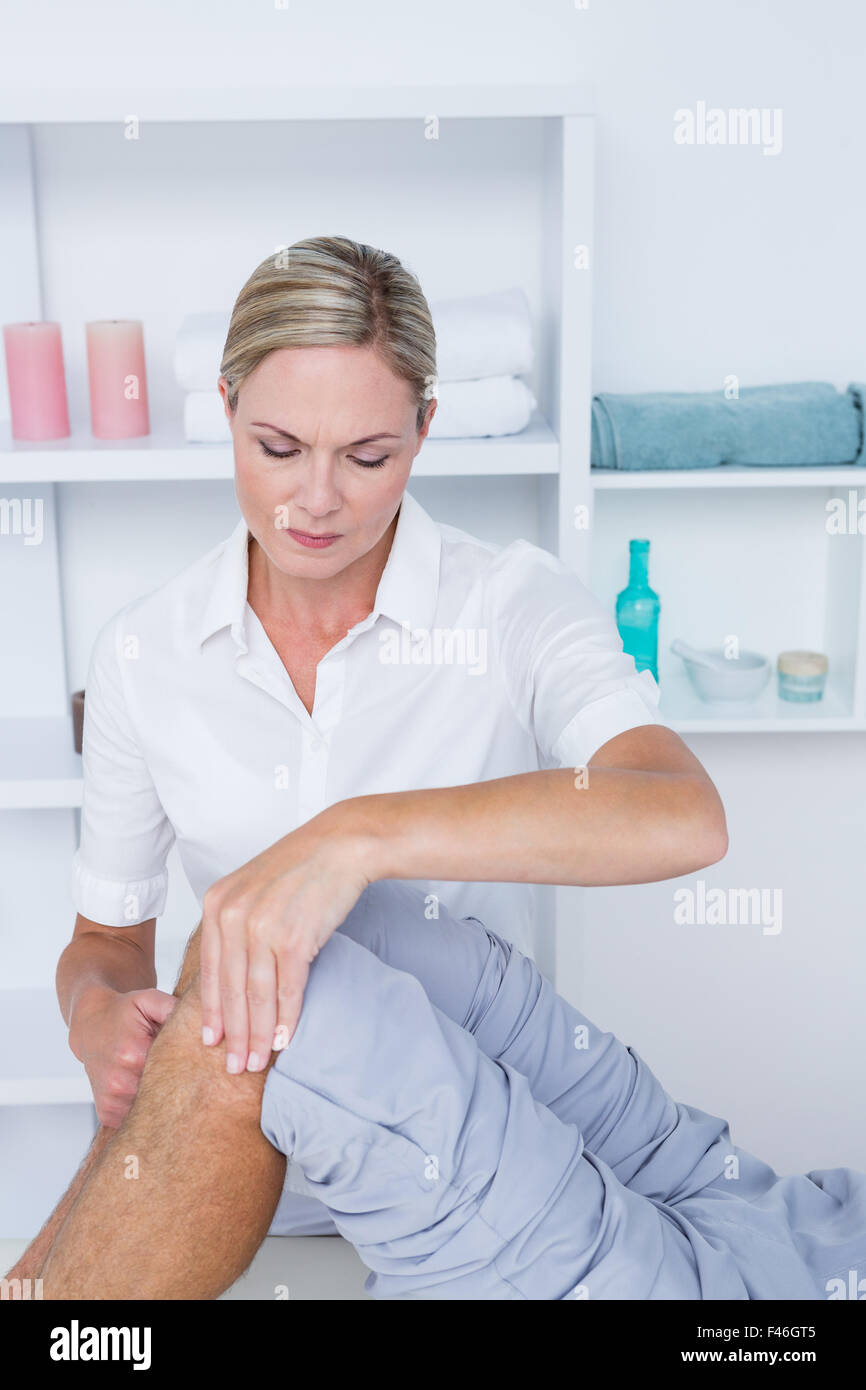 Man having knee massage Stock Photo - Alamy