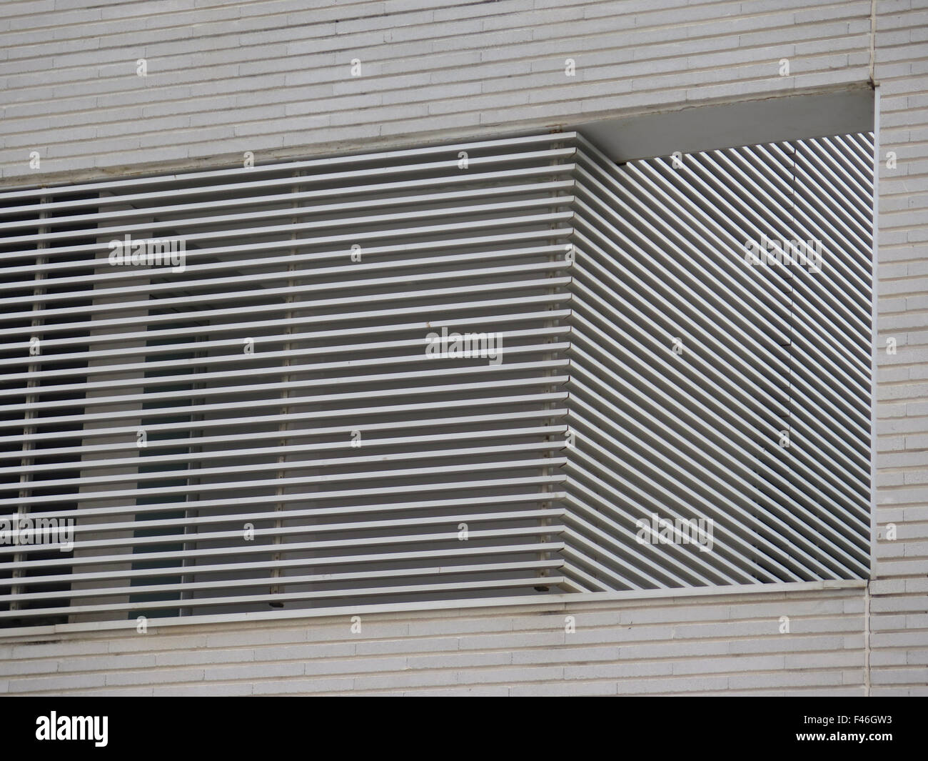 Detail of modern building wall with brick slits Stock Photo - Alamy