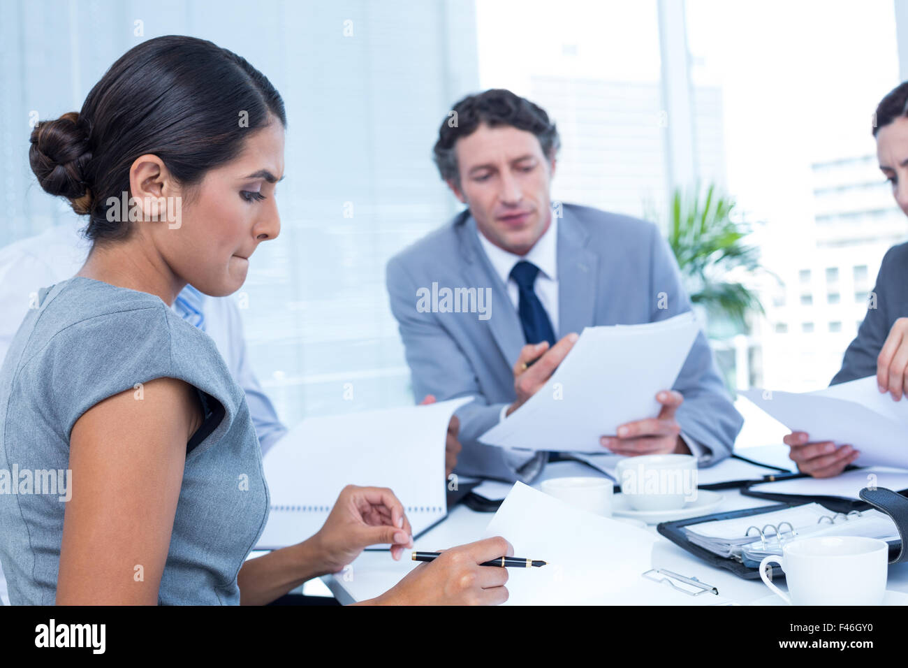Concentrated business team working together Stock Photo - Alamy