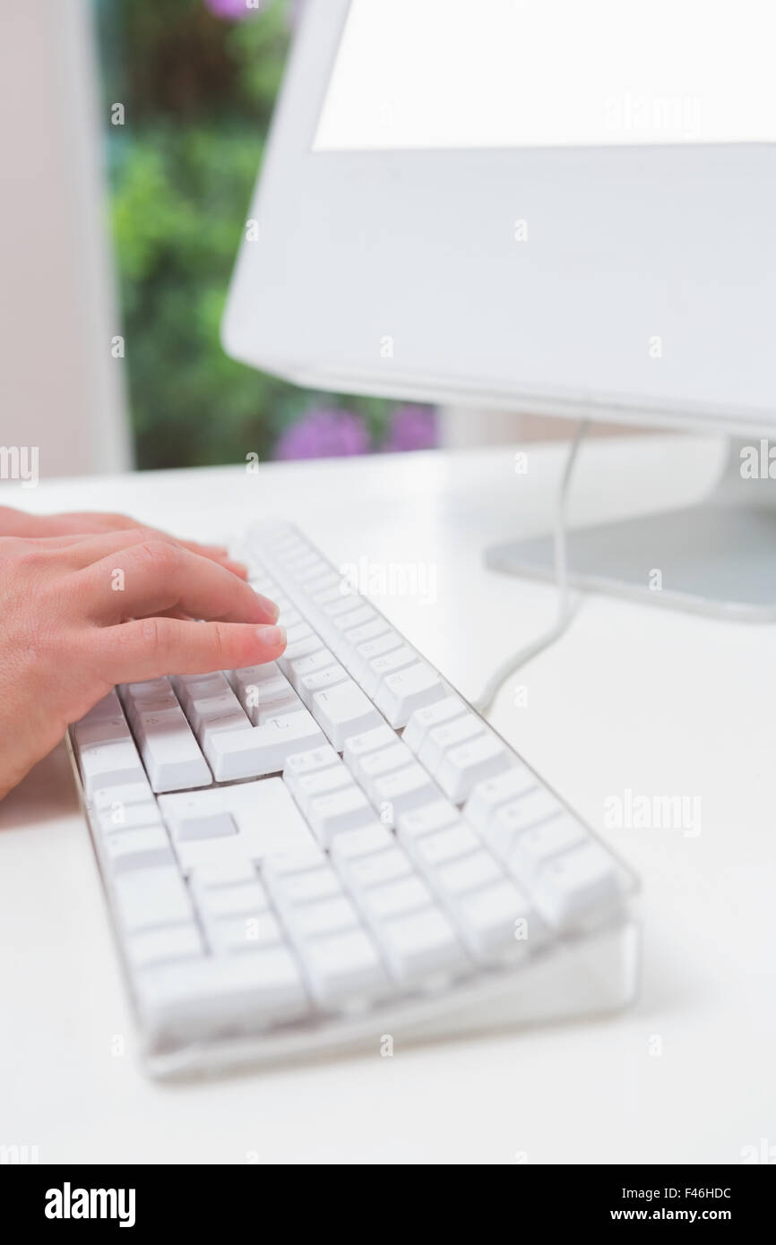 Close up view of hand typing on keyboard Stock Photo - Alamy
