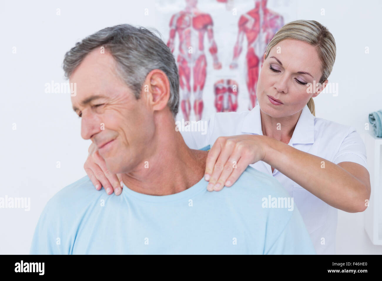 Doctor stretching her patient neck Stock Photo - Alamy