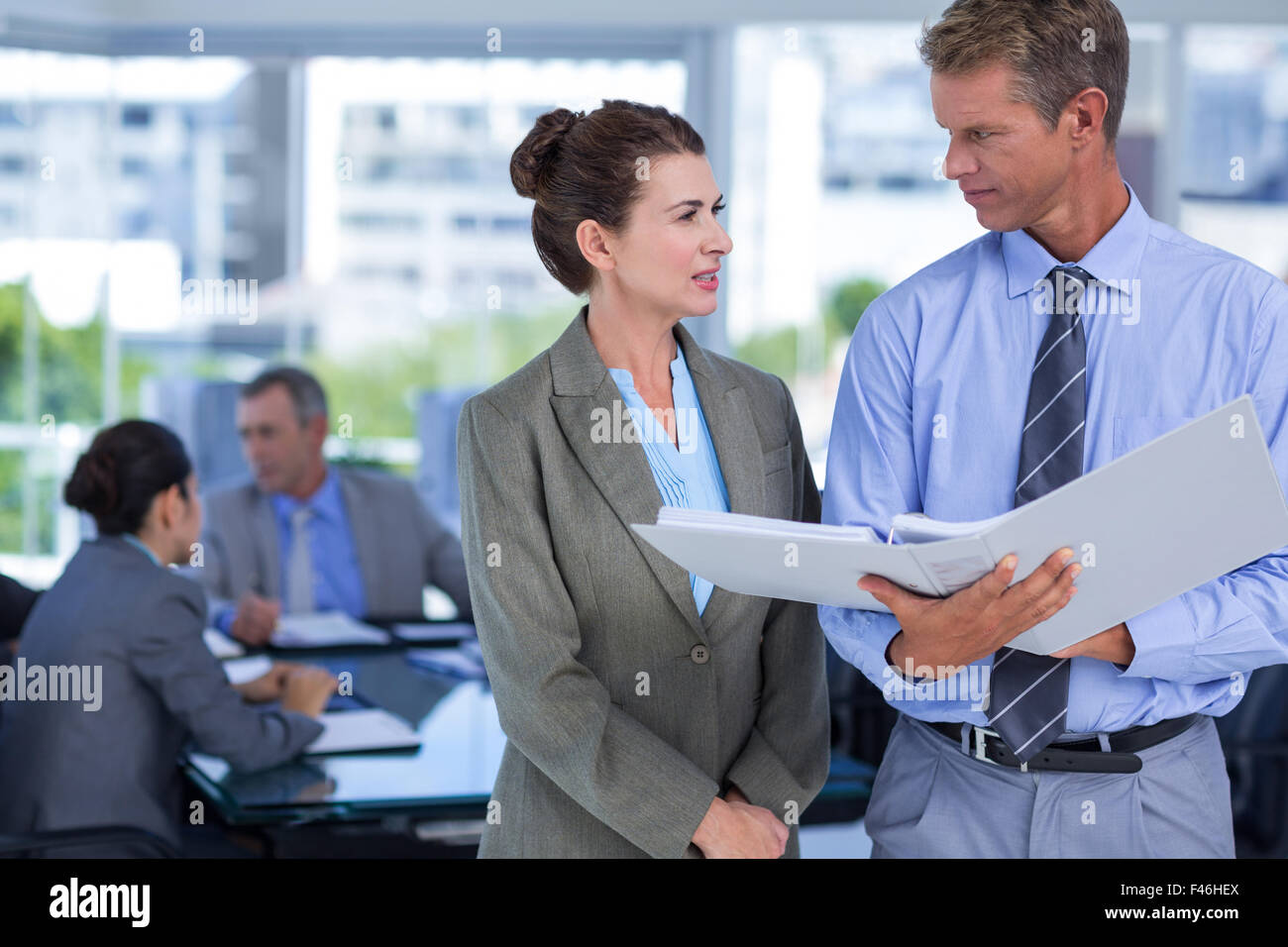 Business colleagues discussing about work Stock Photo - Alamy