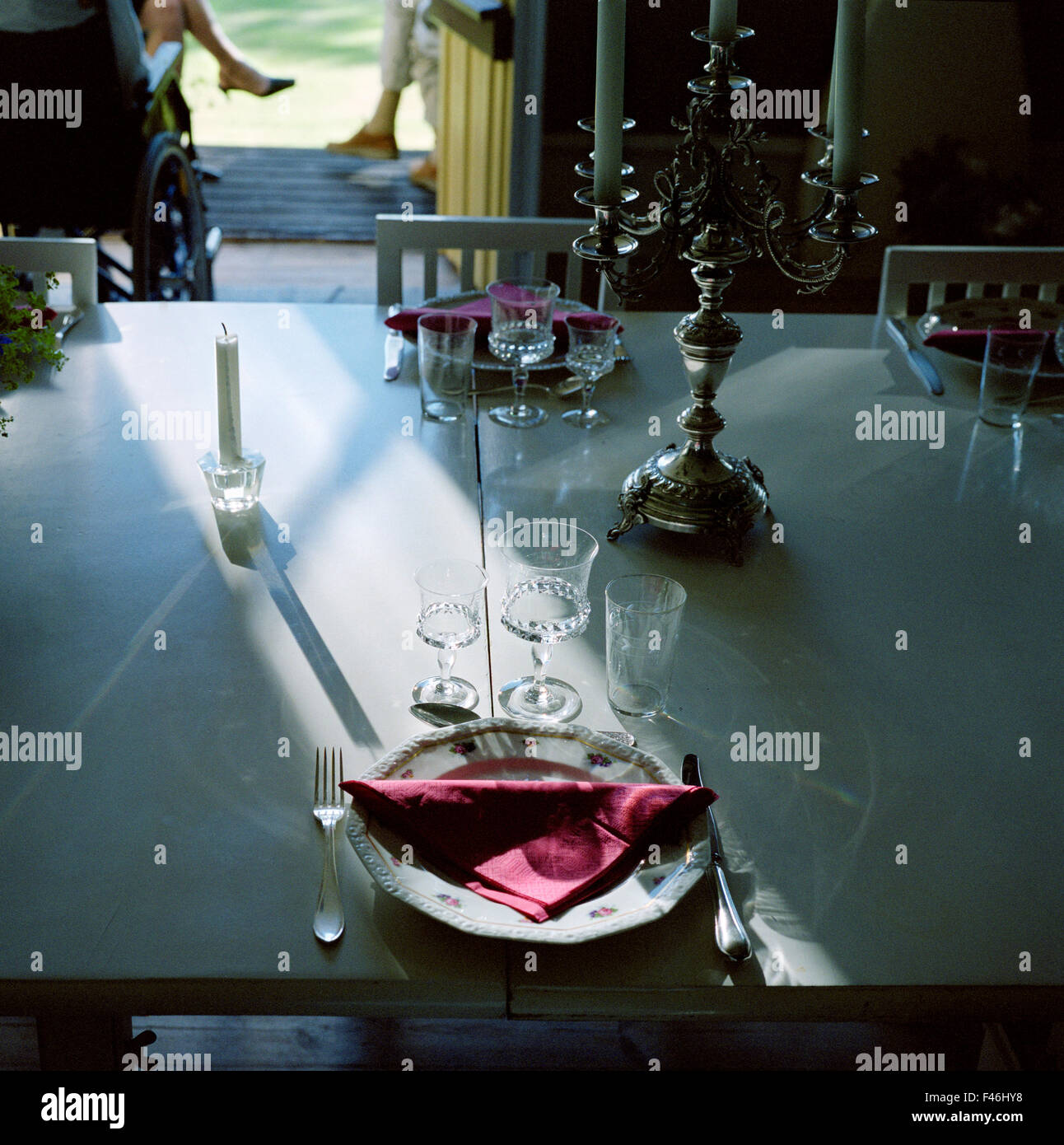 Sunlight on a set table Stock Photo - Alamy