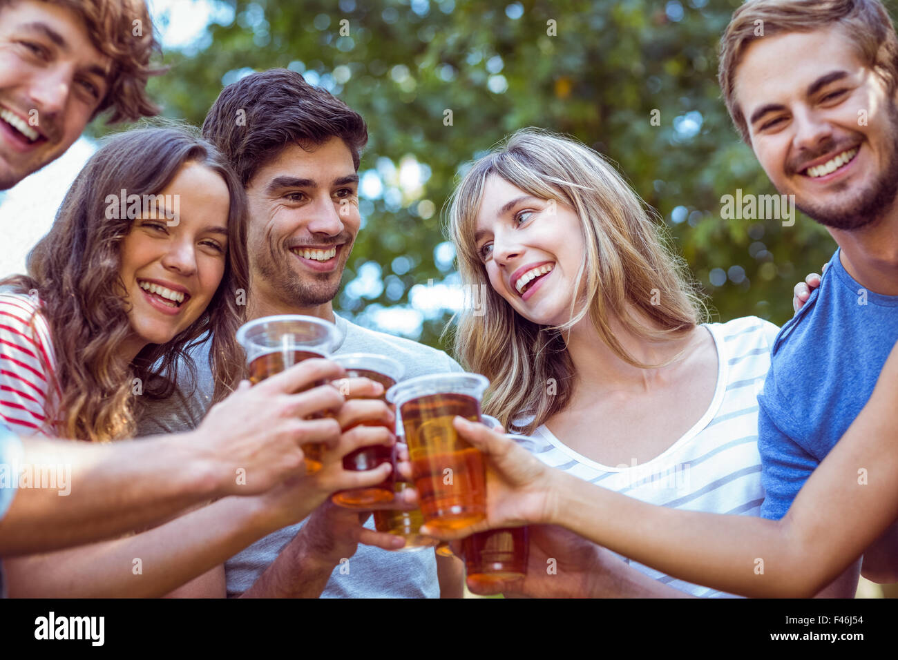 Happy friends in the park Stock Photo - Alamy