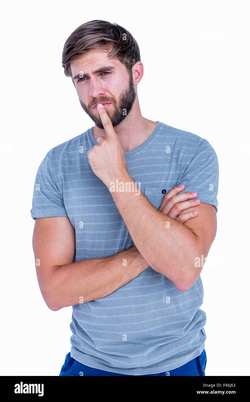 Handsome man thinking with finger on lips Stock Photo - Alamy