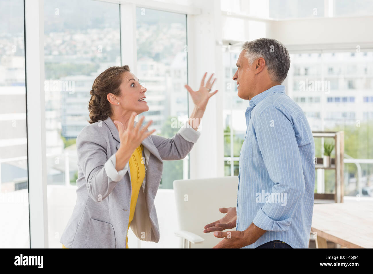 Creative business people having a disagreement Stock Photo - Alamy