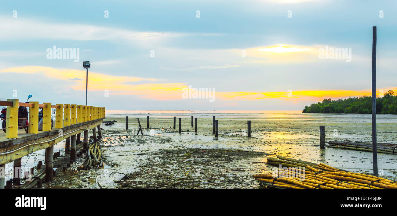 Jetty with sunset Stock Photo - Alamy