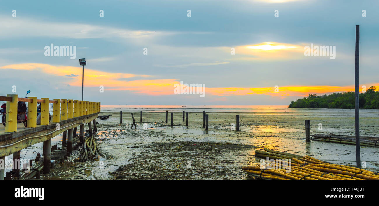 Jetty with sunset Stock Photo - Alamy