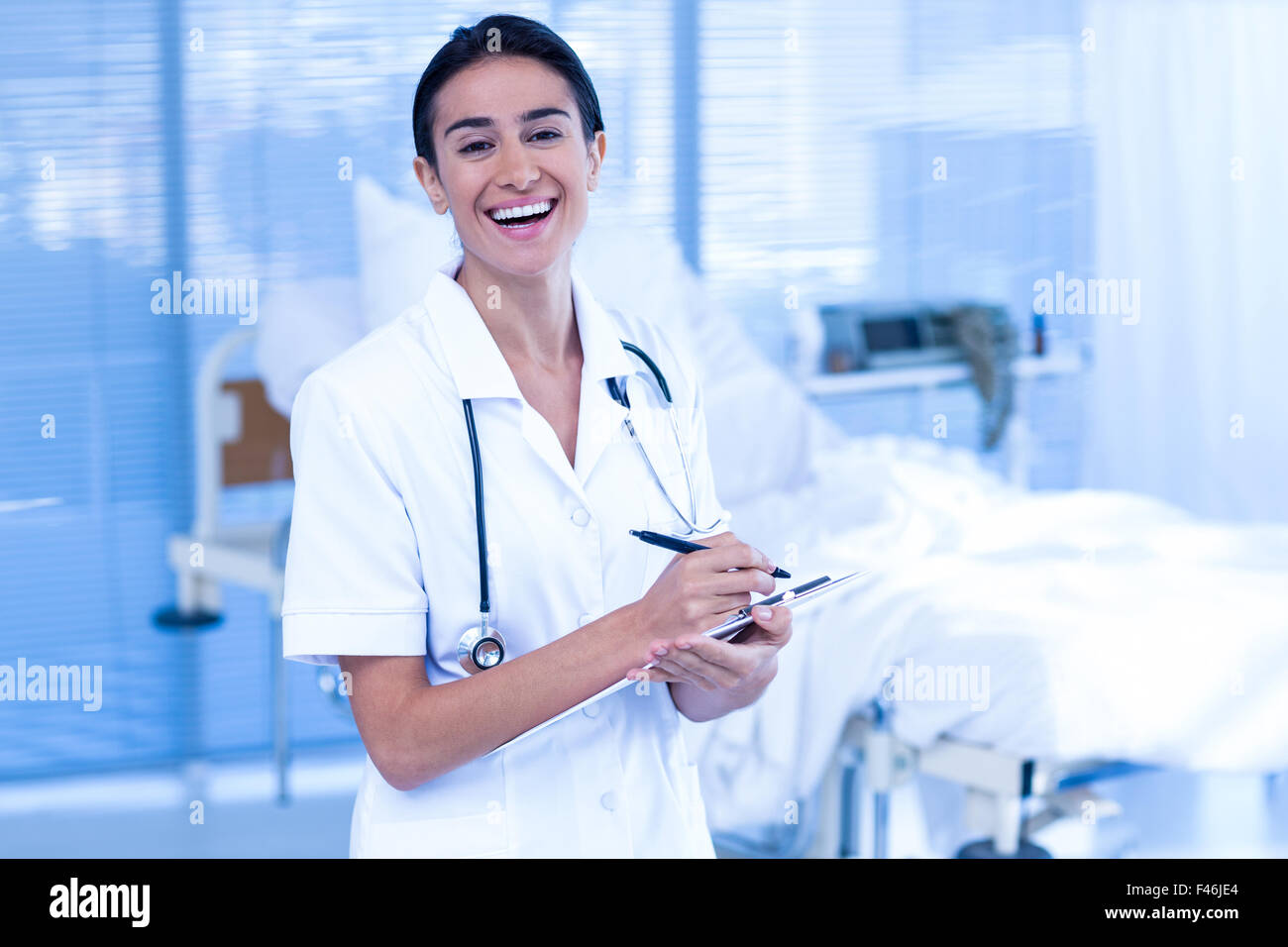 Nurse smiling at the camera Stock Photo - Alamy