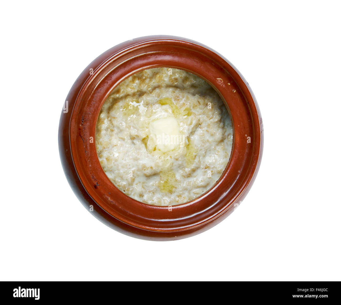 oatmeal in pot isolated on white background Stock Photo - Alamy