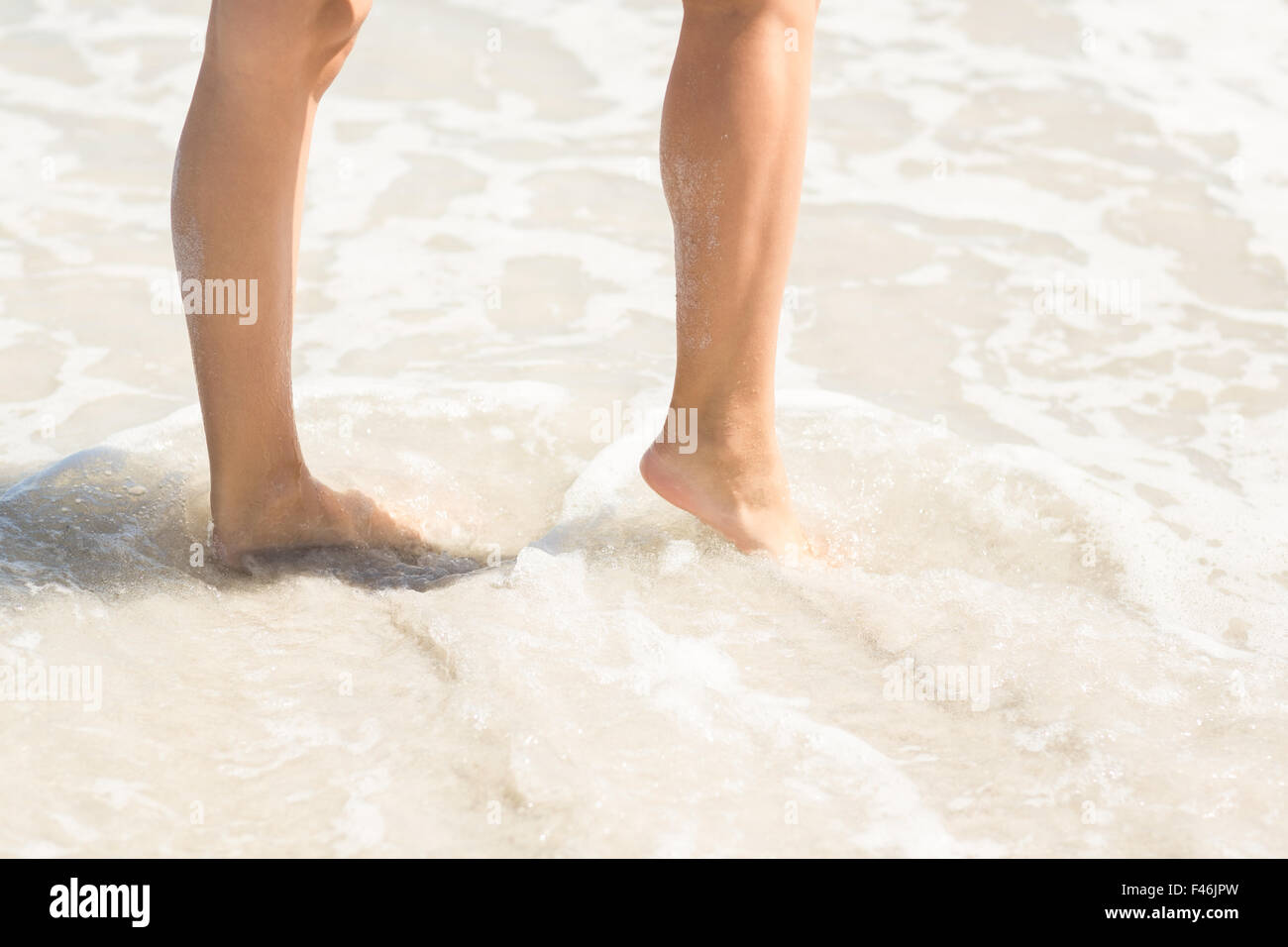 Close up view of woman foot on water Stock Photo - Alamy