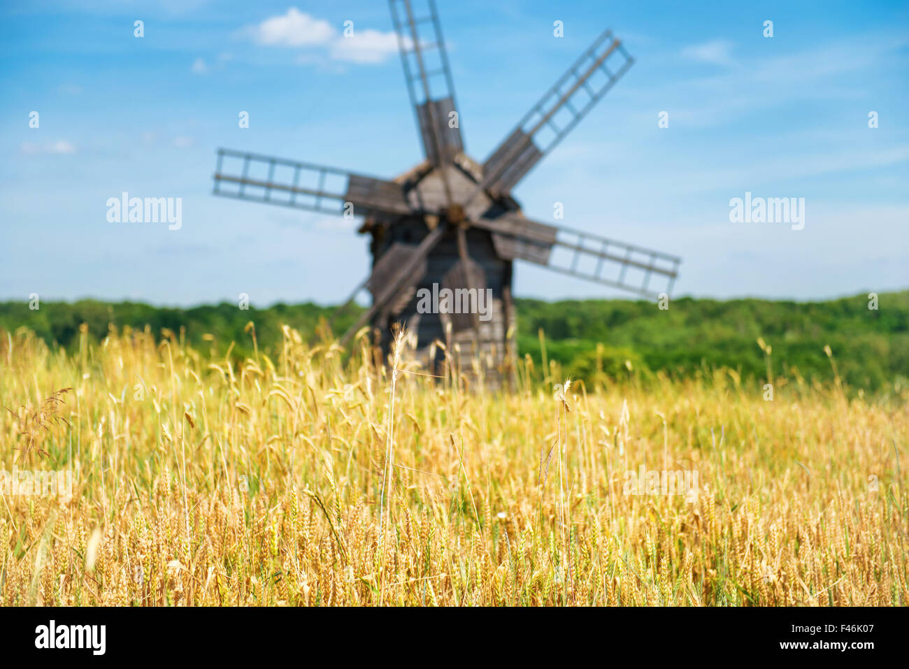 Mill on the wheat field Stock Photo - Alamy