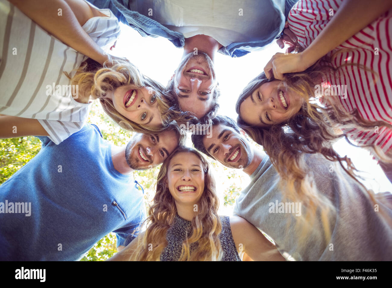 Happy friends in the park Stock Photo - Alamy