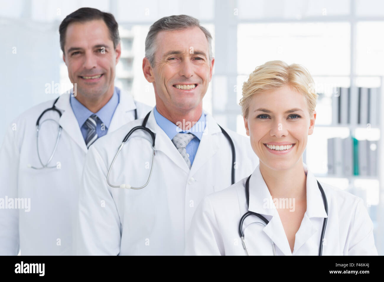 Doctors smiling at camera Stock Photo - Alamy