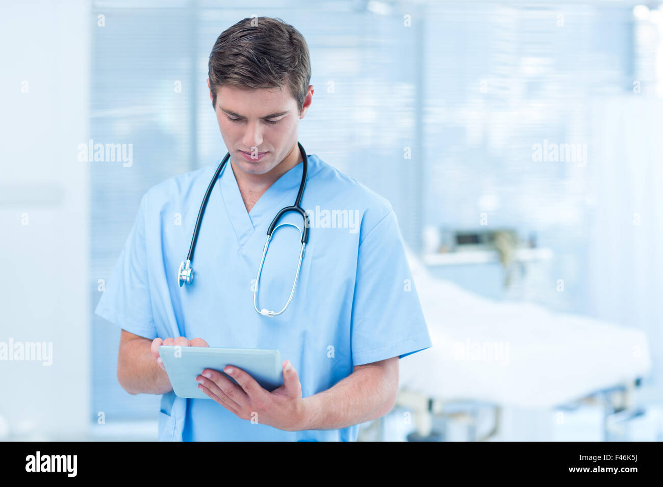 Doctor holding tablet Stock Photo - Alamy
