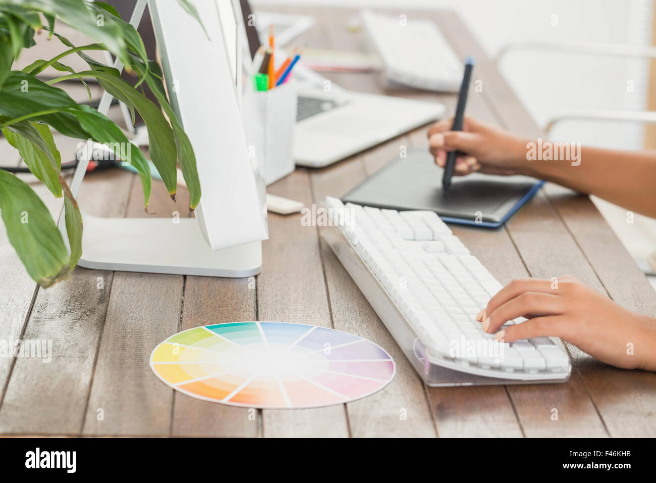 Graphic designer using a graphics tablet Stock Photo - Alamy