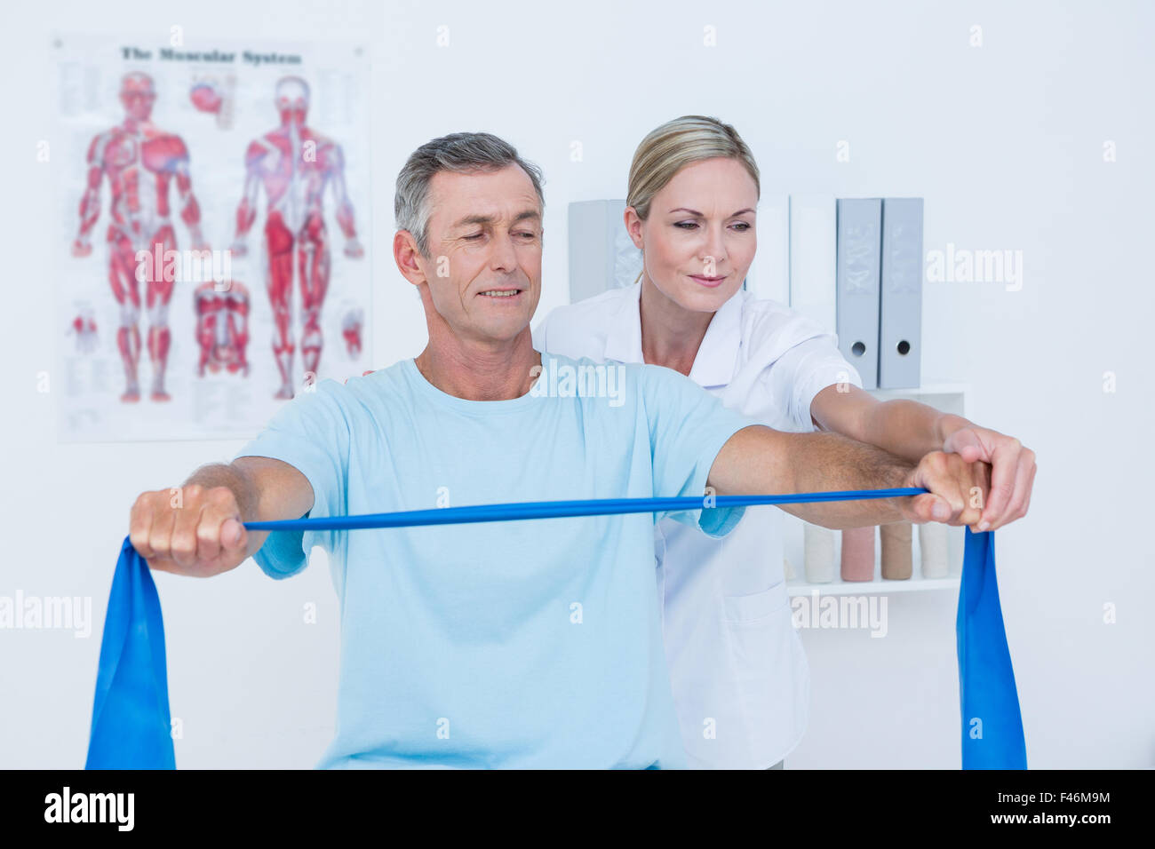 Doctor examining her patient back Stock Photo - Alamy