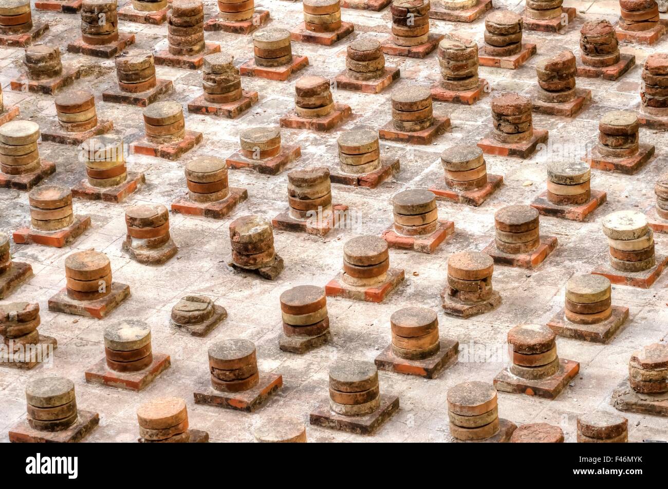 A view of the archaeological ruins of brick vaults supporting the floor ...