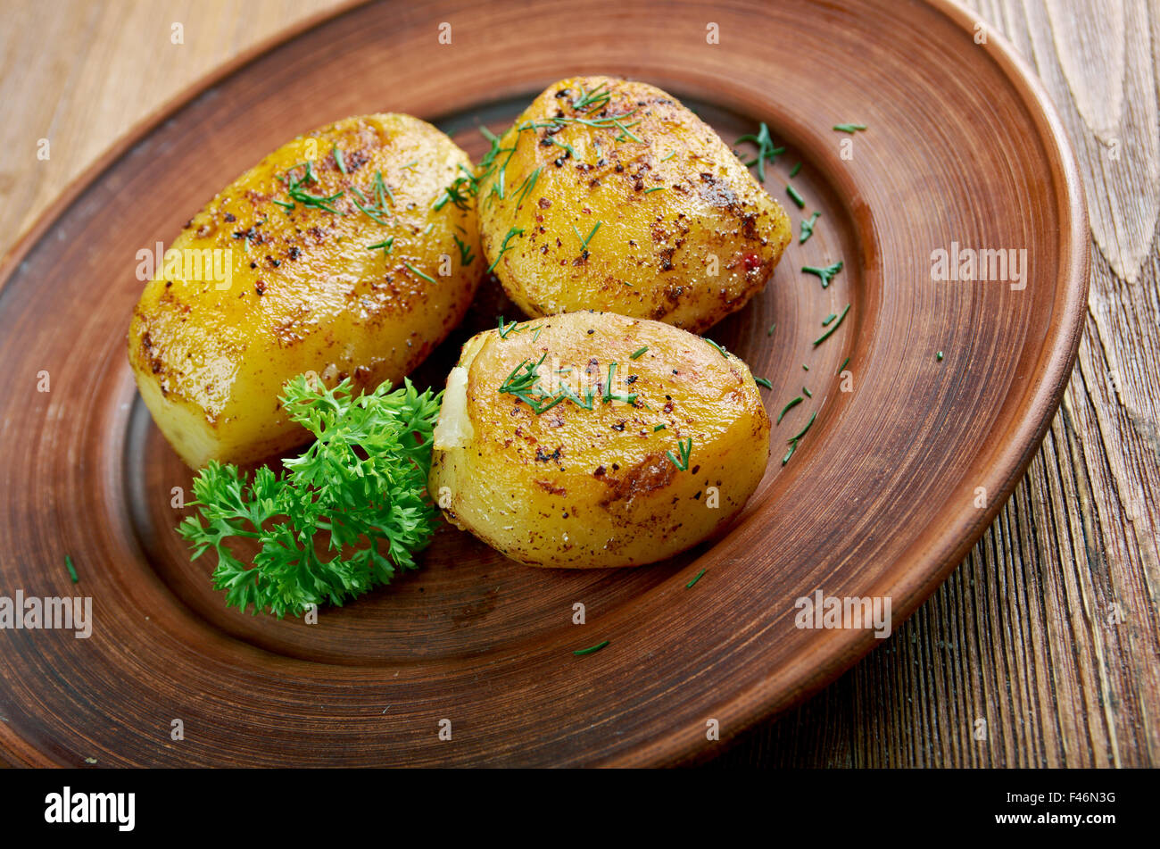 Imthawoma - Libyan potatoes in tomato sauce and spices Stock Photo - Alamy