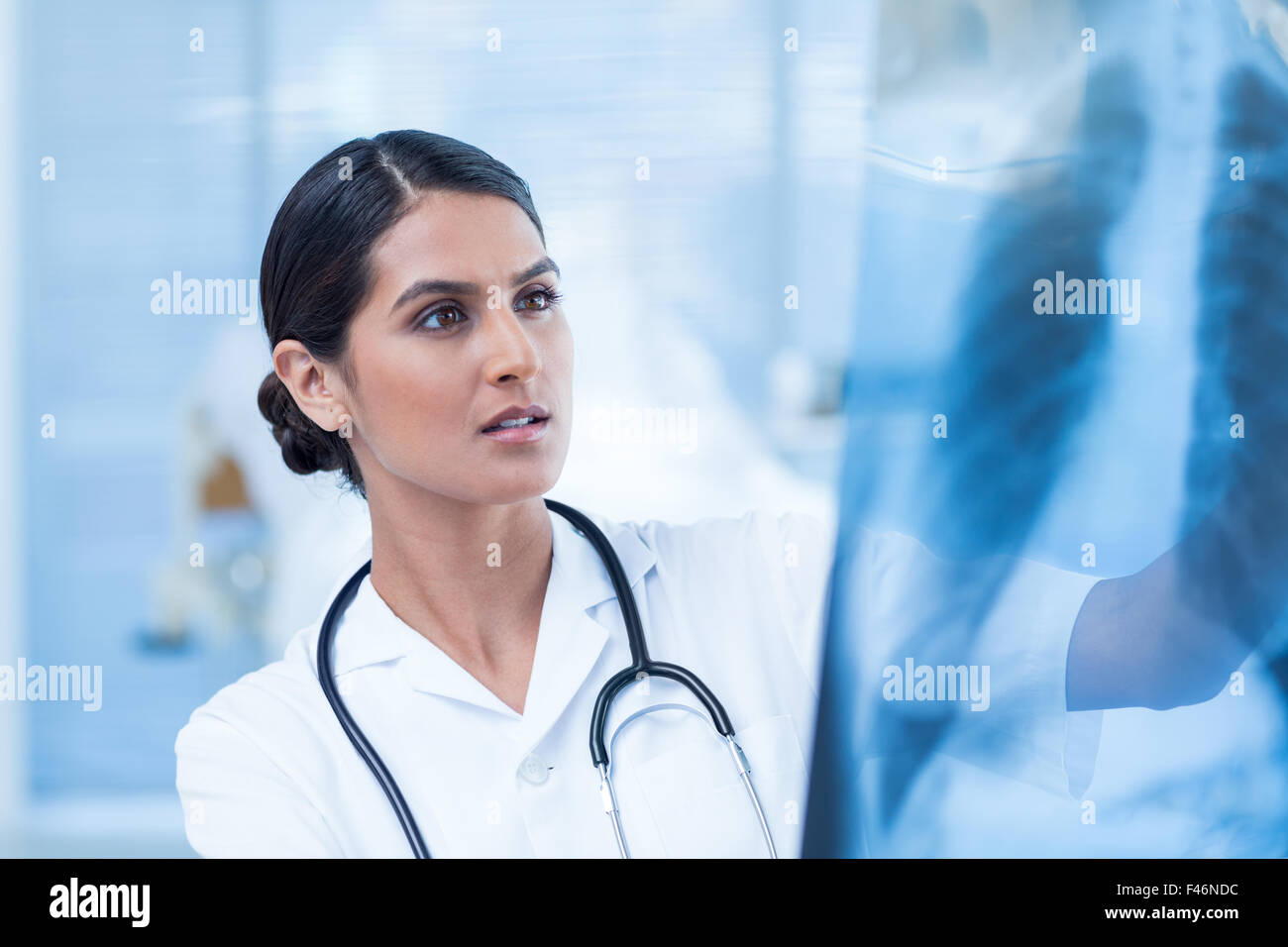 Beautiful doctor analyzing xray Stock Photo - Alamy