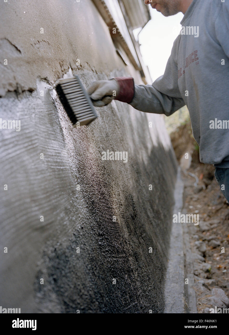 A man building a wall, Uppsala, Sweden Stock Photo - Alamy