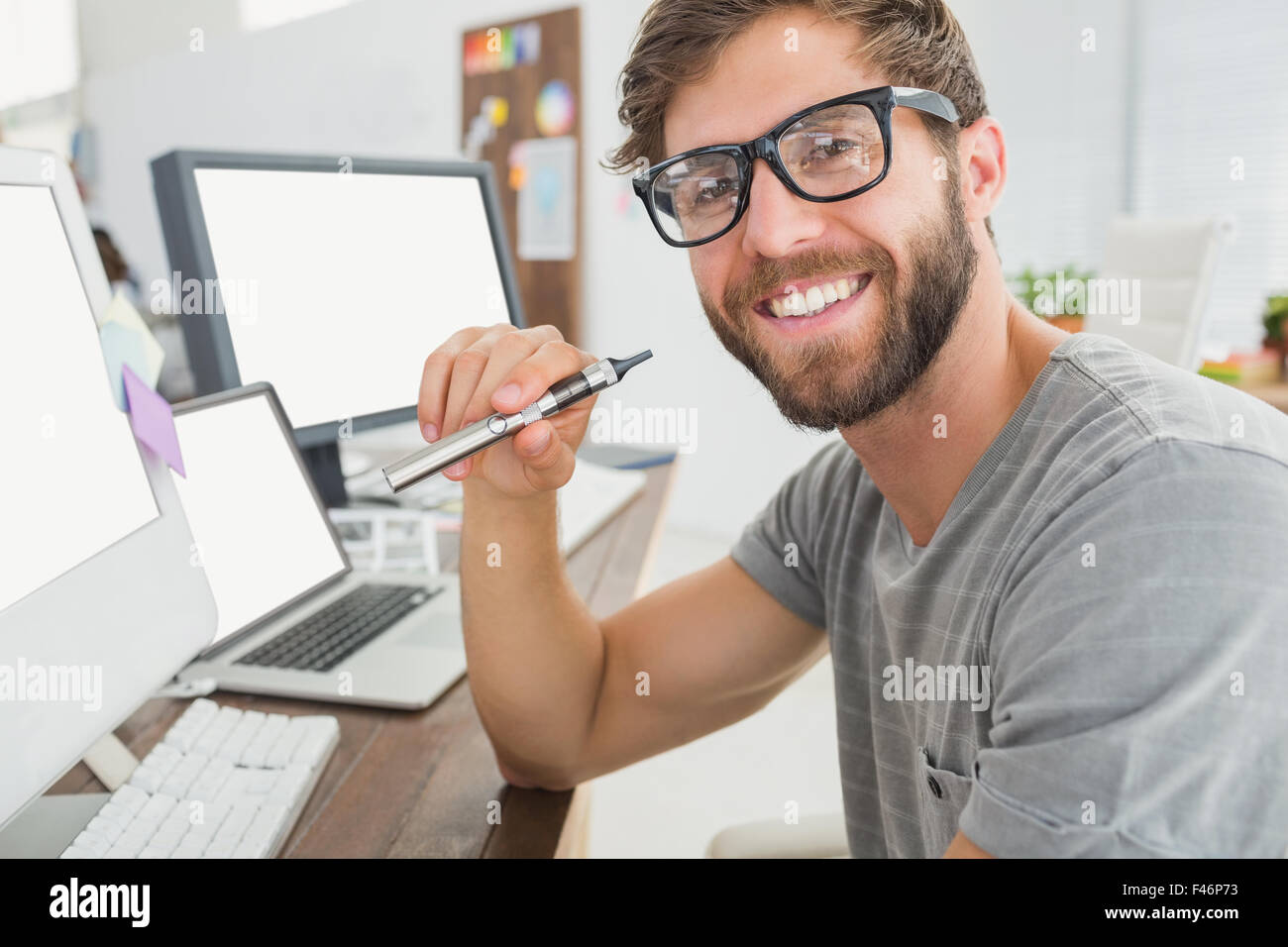 Businessman smoking an electronic cigarette Stock Photo - Alamy