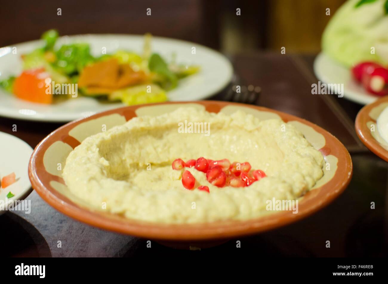 Lebanese food starter, baba ghanoush topped with pomegranate. A photo ...