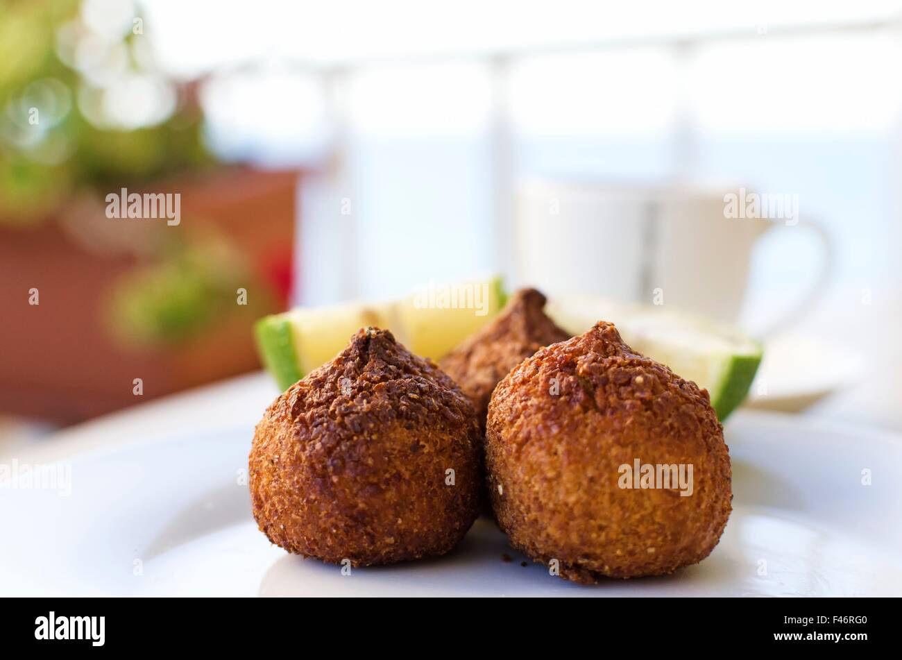 Three small pieces of kebbe, a lebanese dish with mince meat or ...