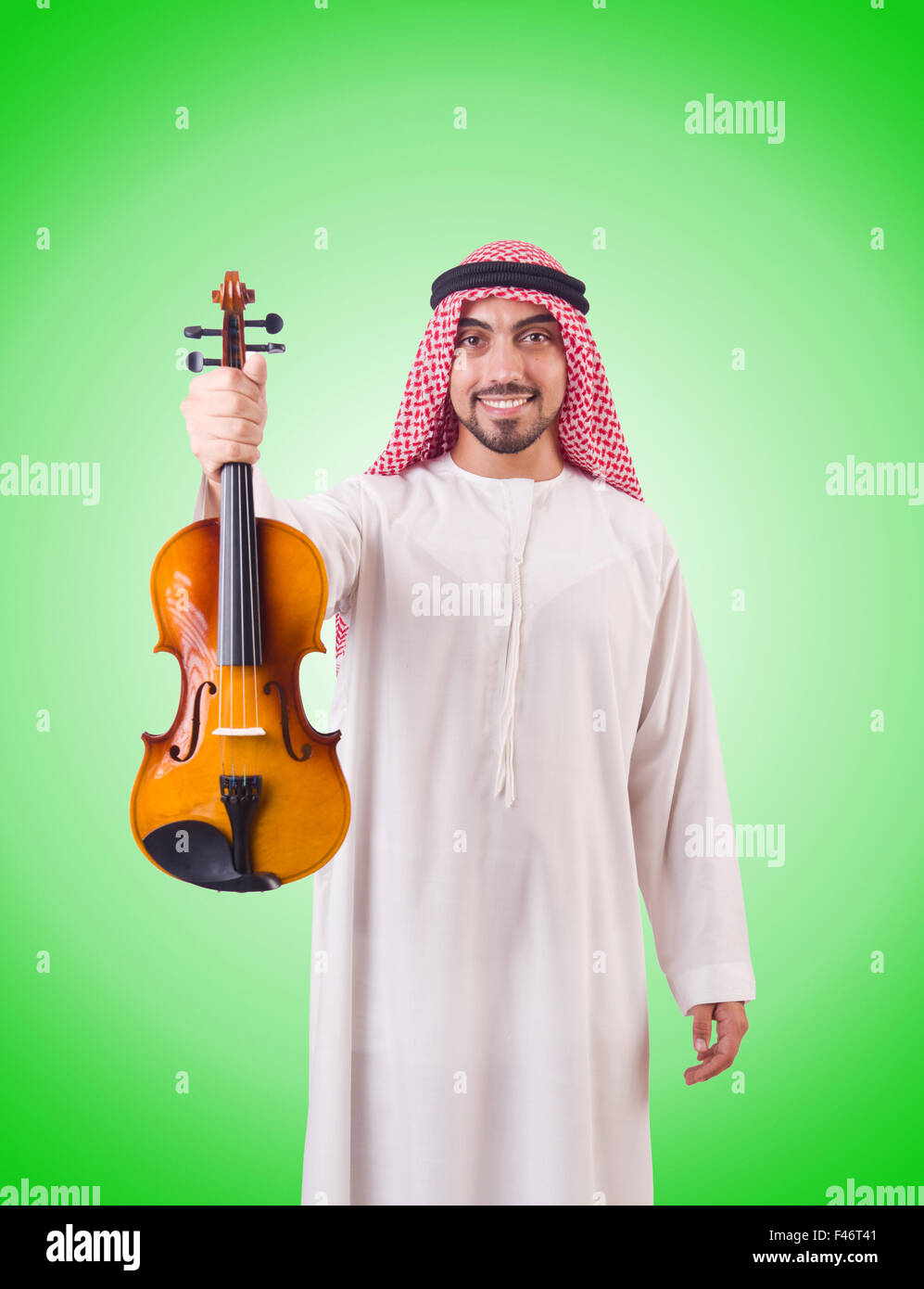 Arab man playing music on white Stock Photo - Alamy