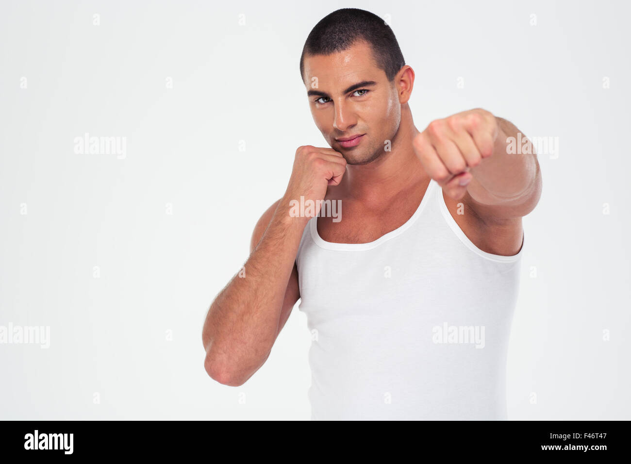 Portrait of a handsome man punching at camera isolated on a white ...