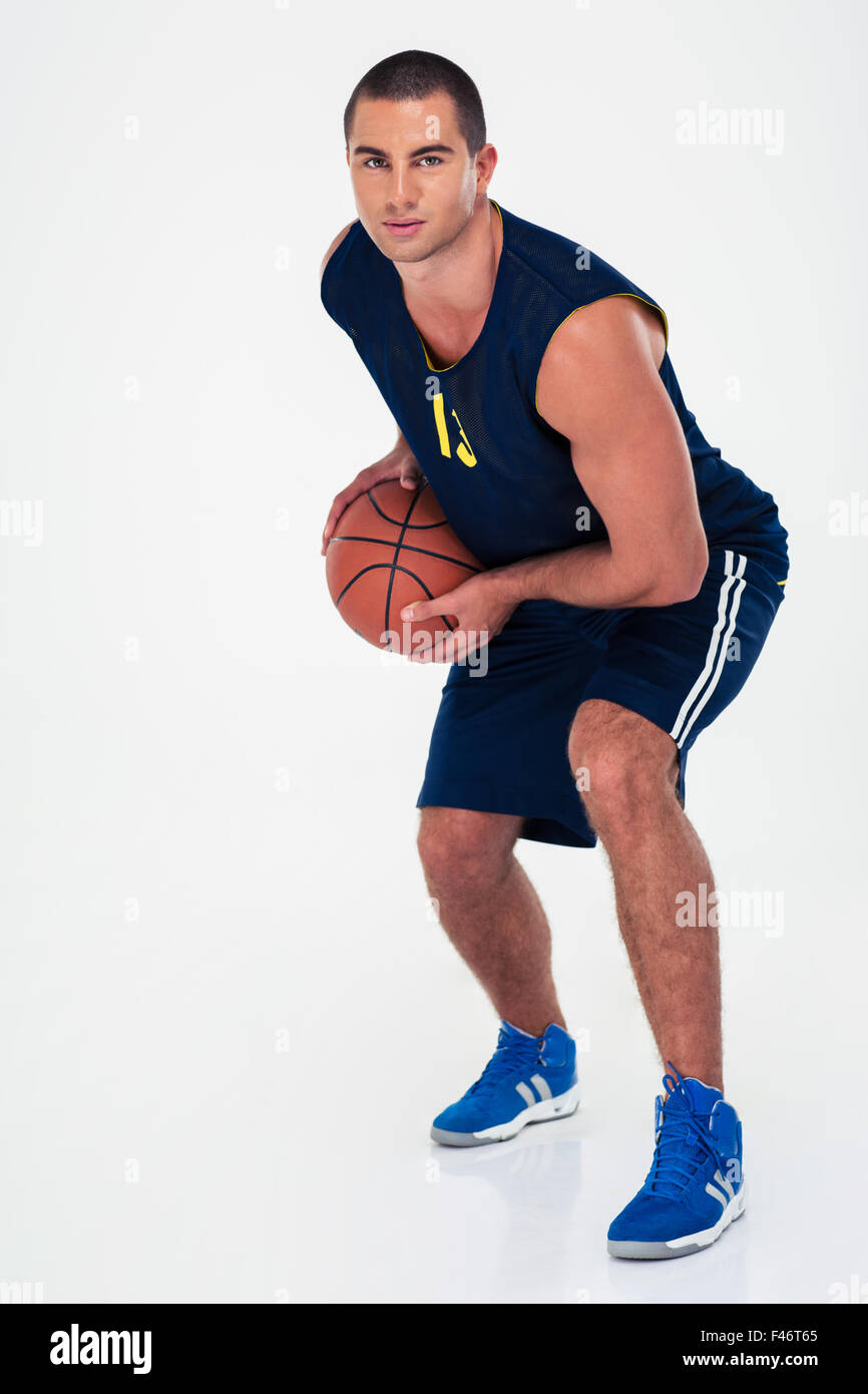 Full length portrait of a man playing in basketball isolated on a white ...