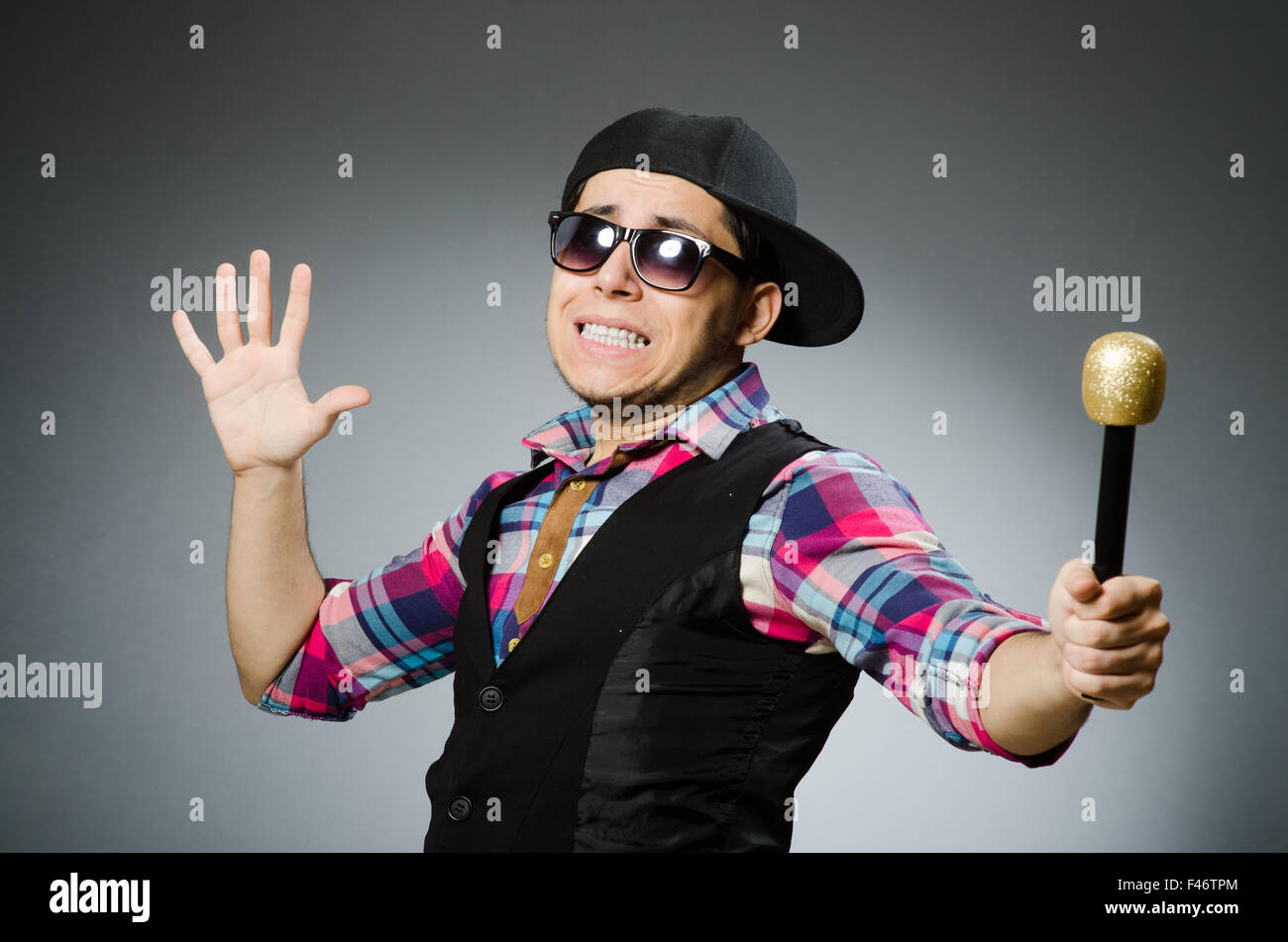 Funny man singing in karaoke Stock Photo - Alamy